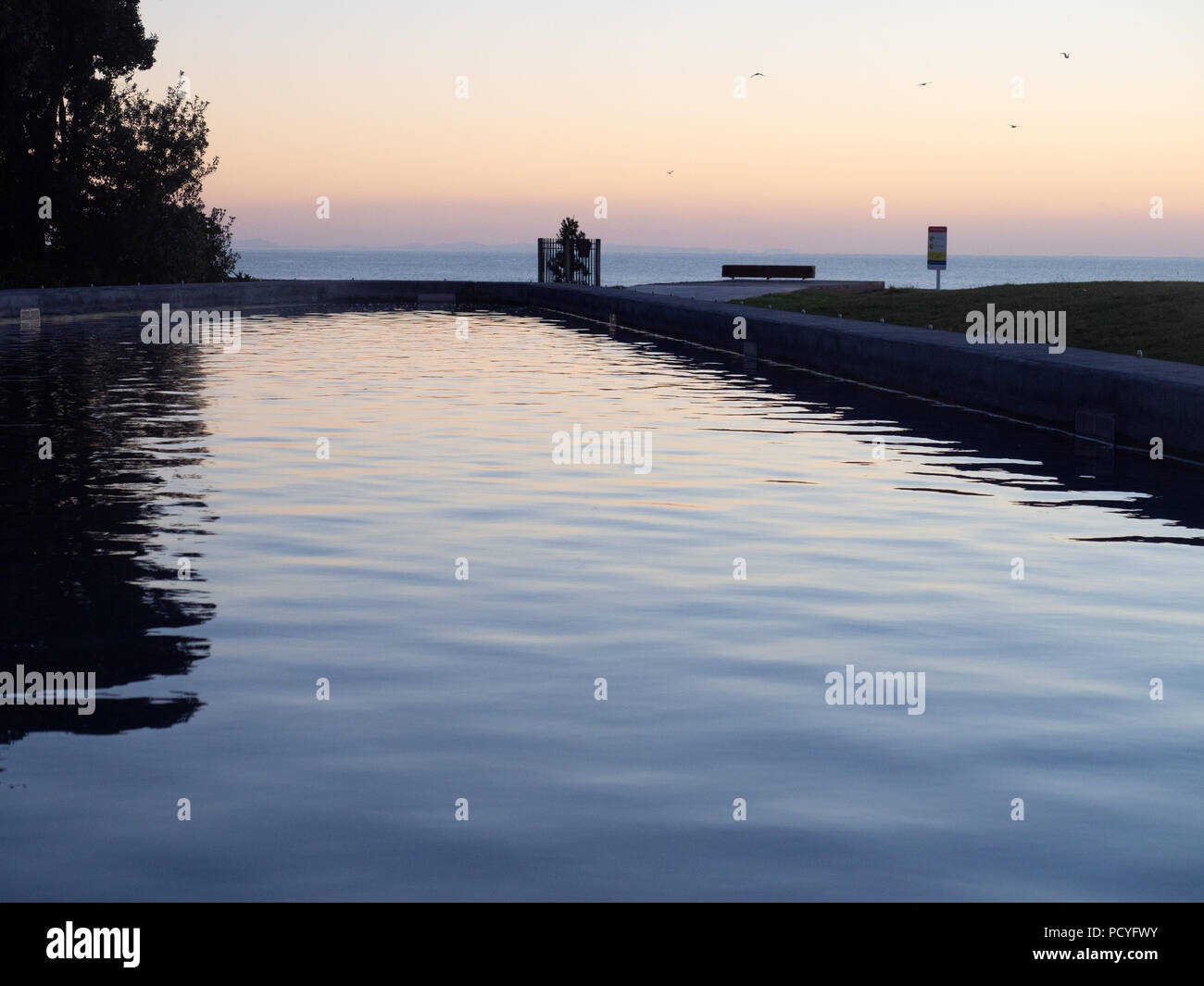 Calm Pond Water On The Beachfront Stock Photo - Alamy