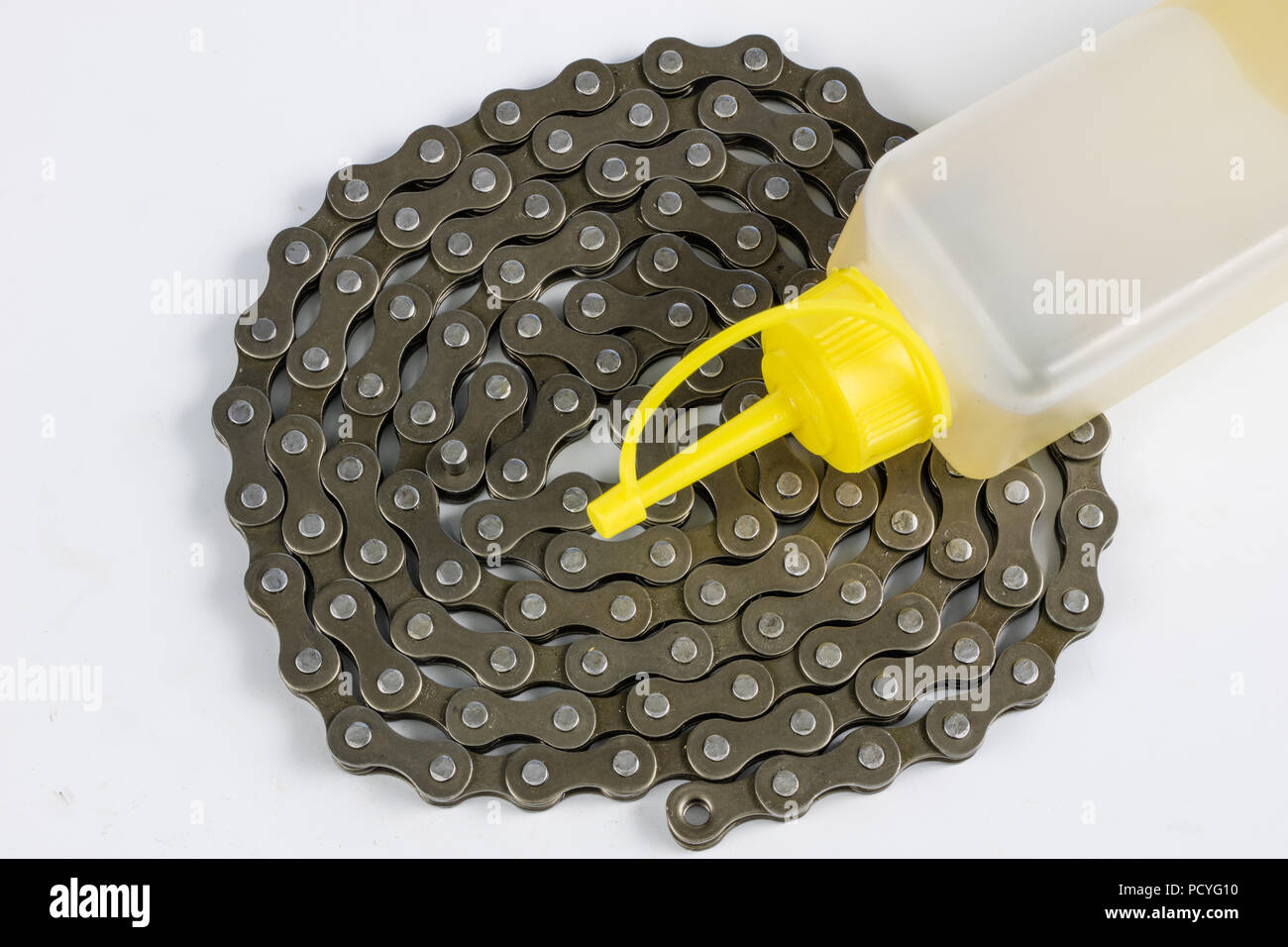 Lubricating the bicycle chain with liquid lubricant. Periodic servicing ...