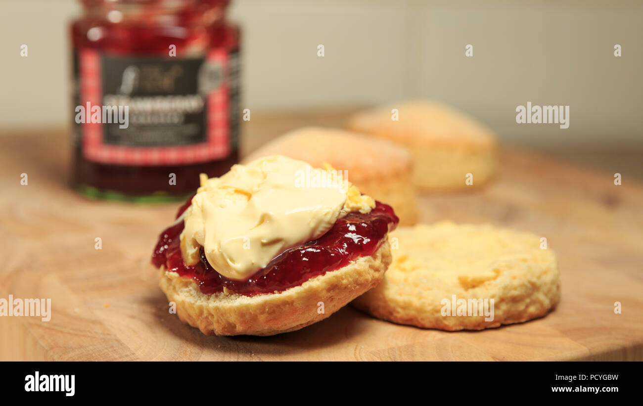Scones with strawberry jam and clotted cream; the main constituent of a ...