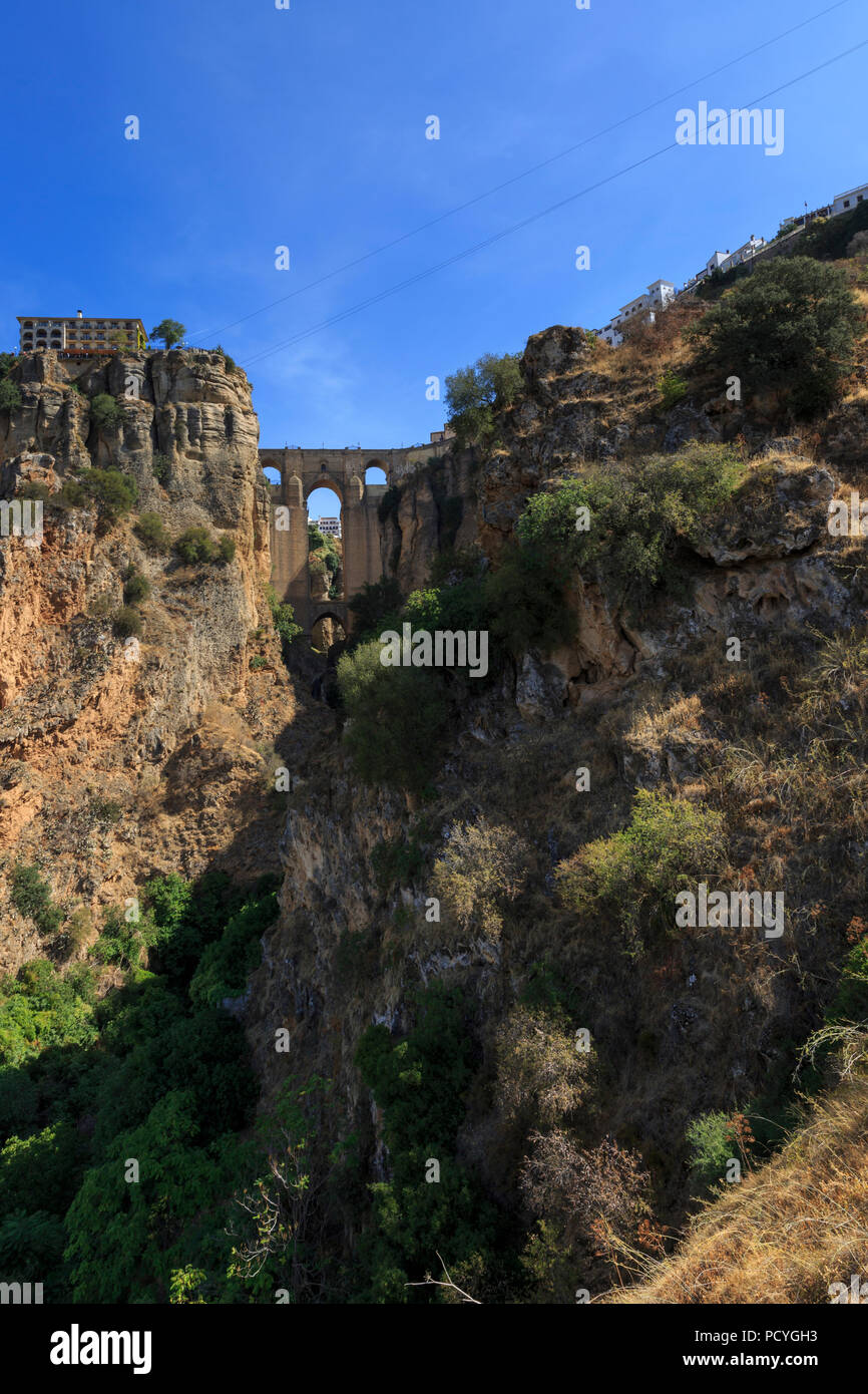 The famous Puente Nuevo (New Bridge) that spans a 120m deep gorge in ...