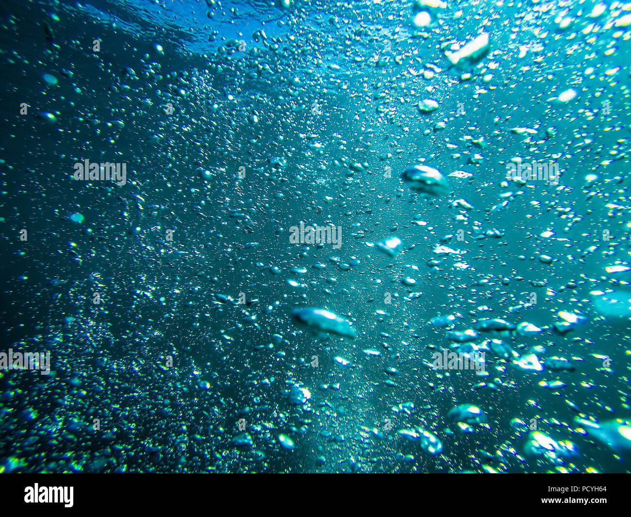 Air boobles in blue sea water. Maldives Stock Photo - Alamy