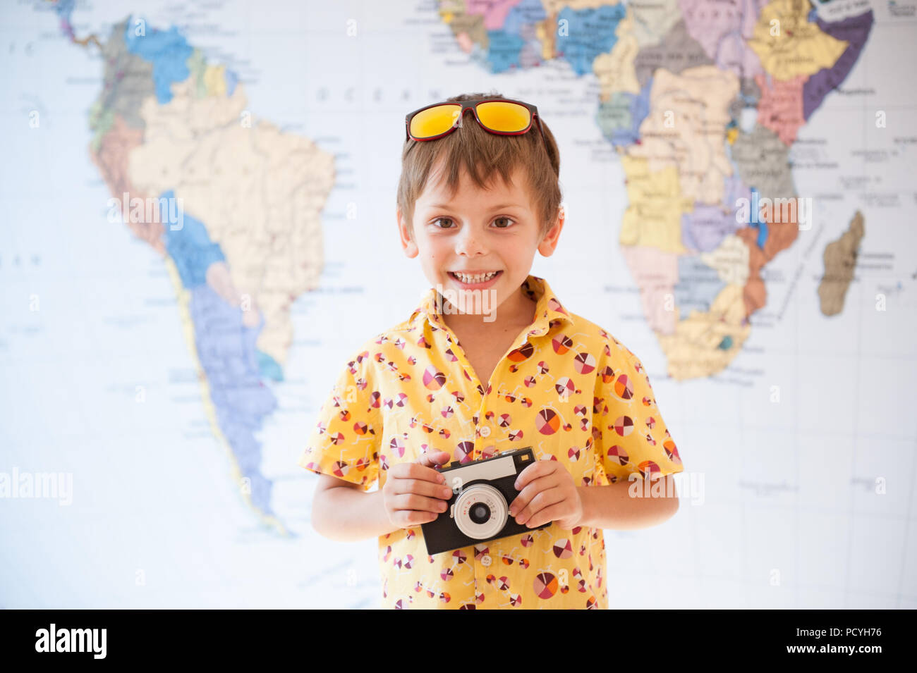 happy smiling caucasian little boy with vintage camera in hands on ...