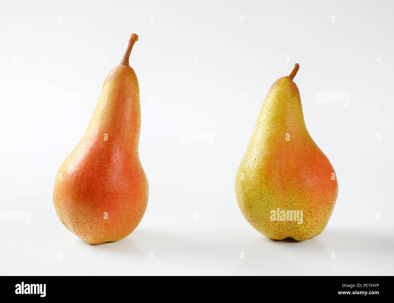 two ripe pears on white background Stock Photo - Alamy