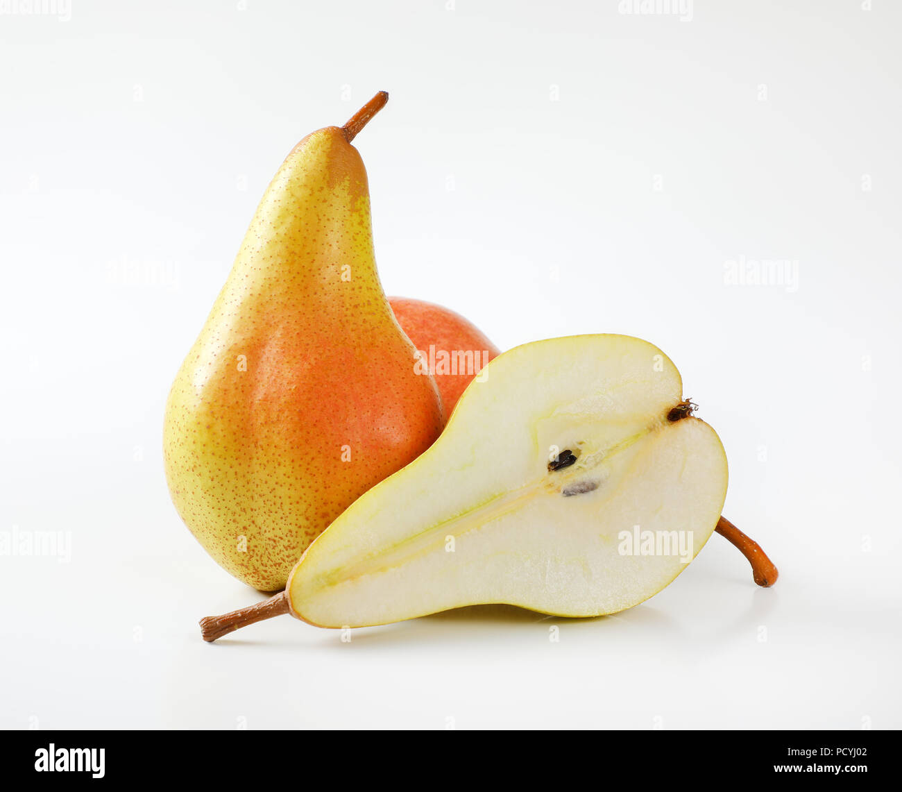 two and half pears on white background Stock Photo - Alamy