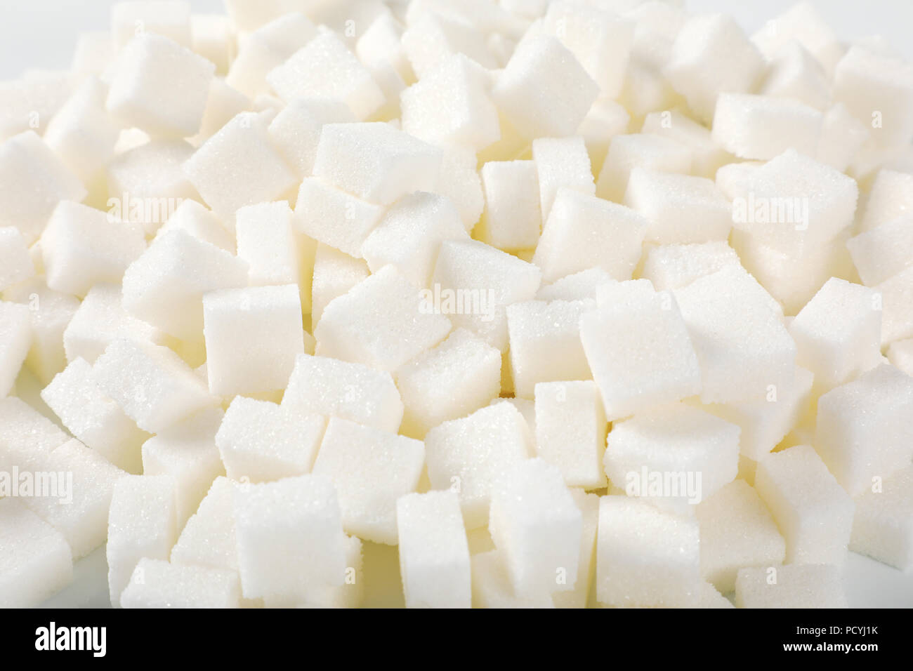 pile of white sugar cubes - close up Stock Photo - Alamy