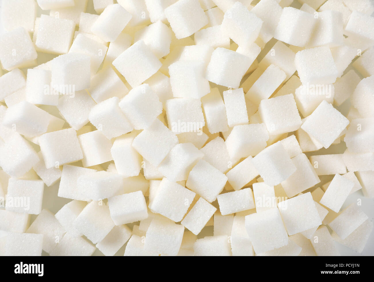 pile of white sugar cubes - full frame Stock Photo - Alamy