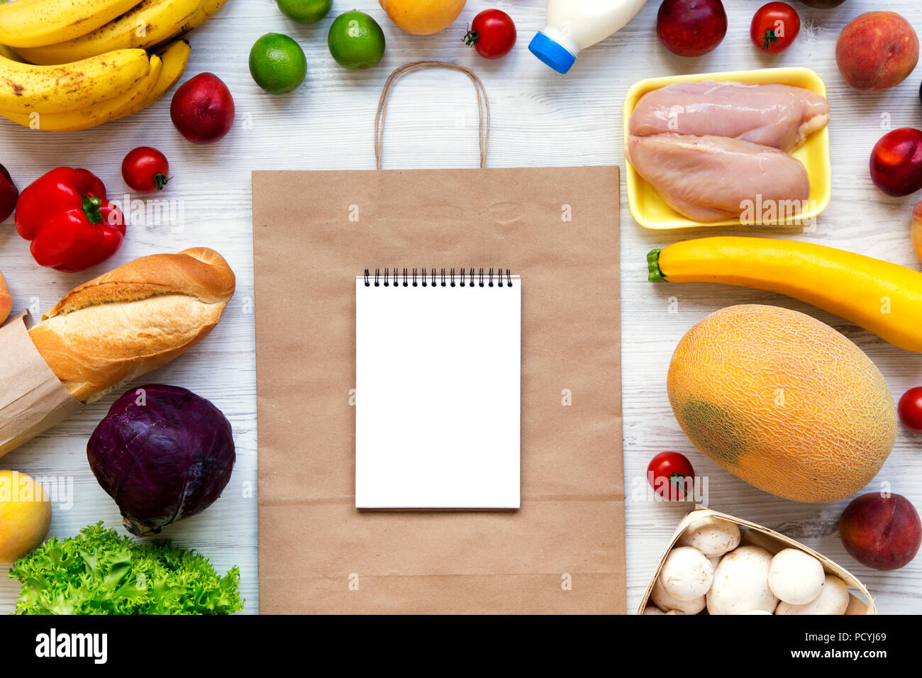 Shopping concept. Set of different groceries with paper bag and blank ...
