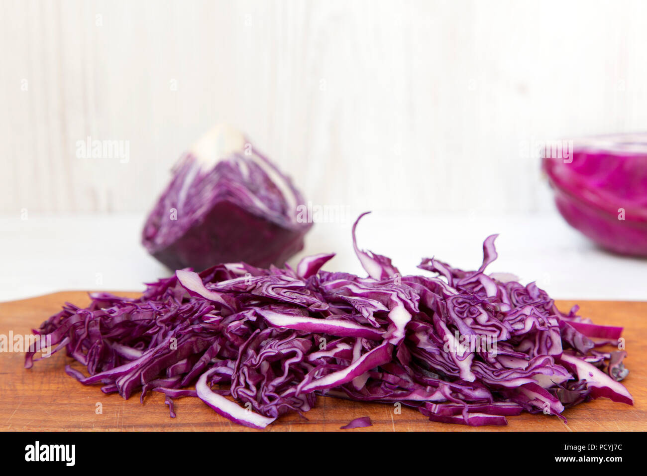 Chopped red cabbage on cutting board, closeup. Side view Stock Photo ...
