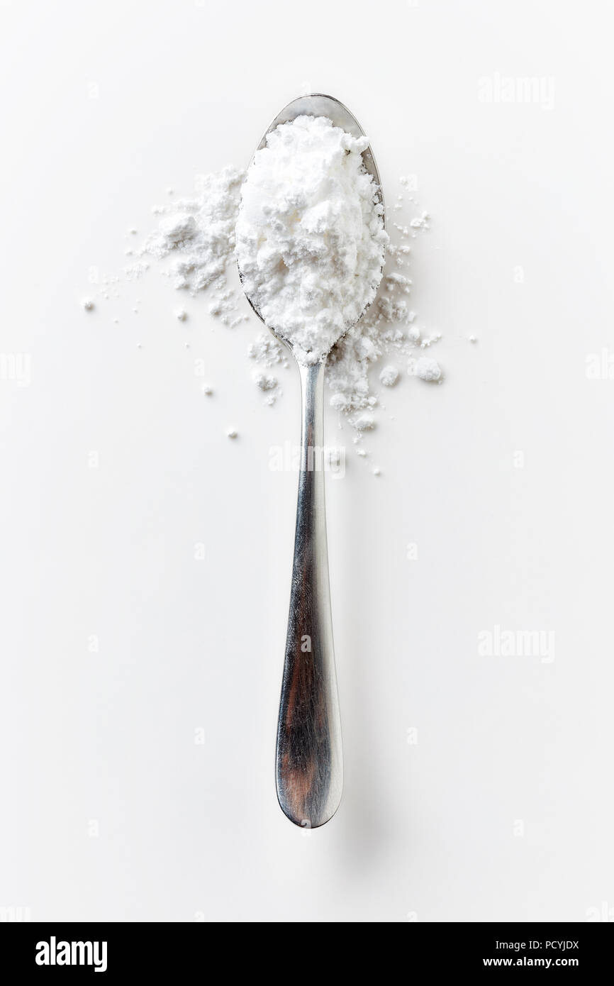 Spoon with powder sugar isolated on white background, top view Stock ...