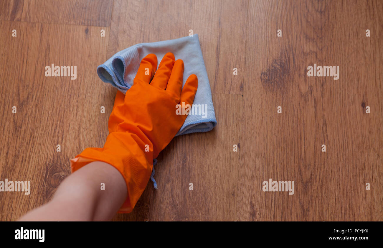 A woman hand Using blue rags wipe the wooden floor Stock Photo - Alamy