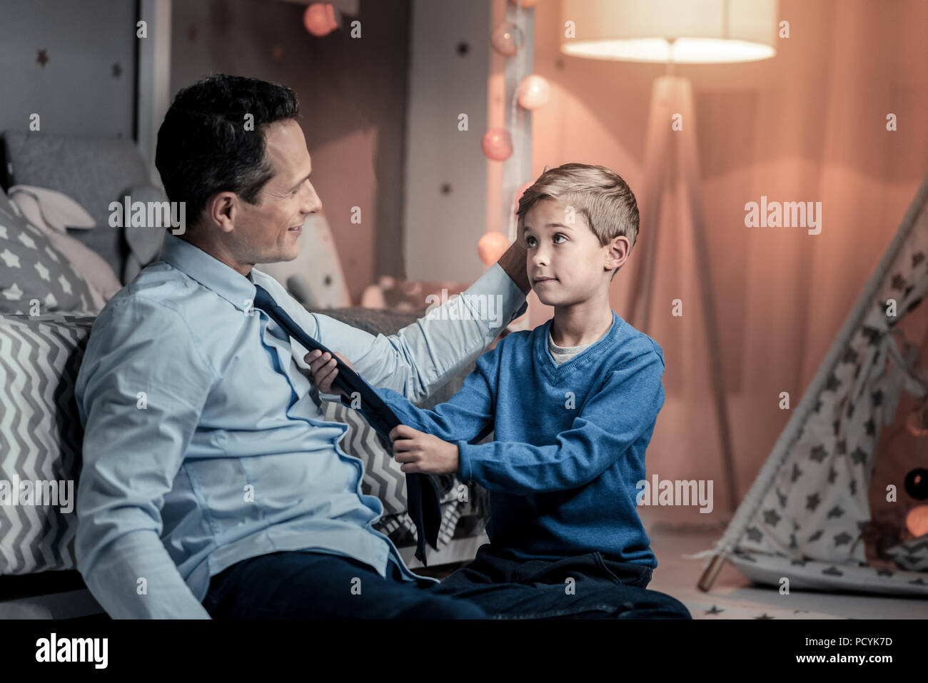 Kind man embracing his child Stock Photo - Alamy