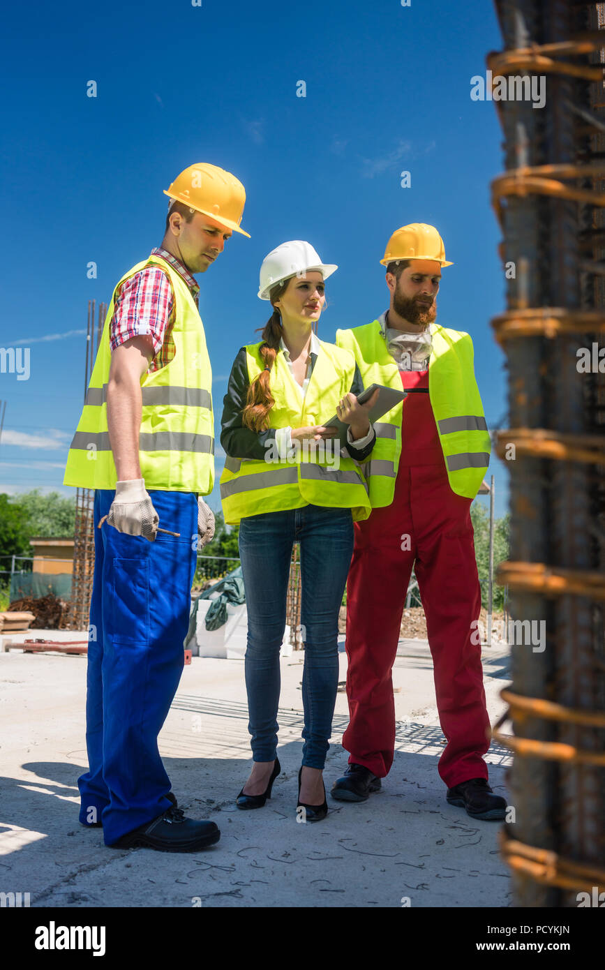 Architect supervising the work in progress on the construction Stock ...