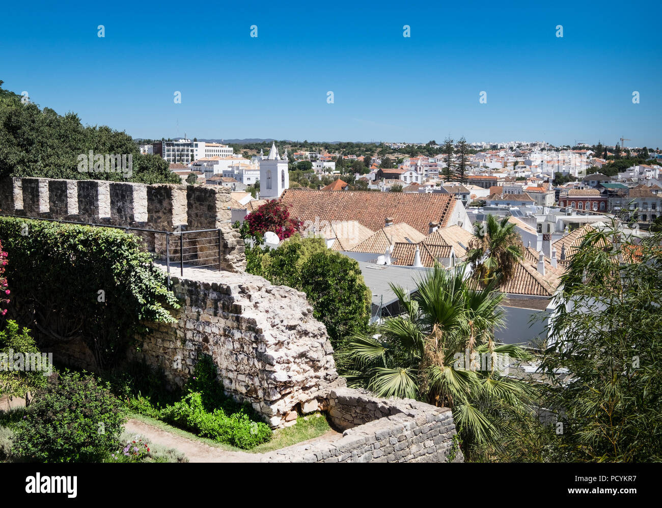 The old walls of Tavira Castle with views across the historic town in ...