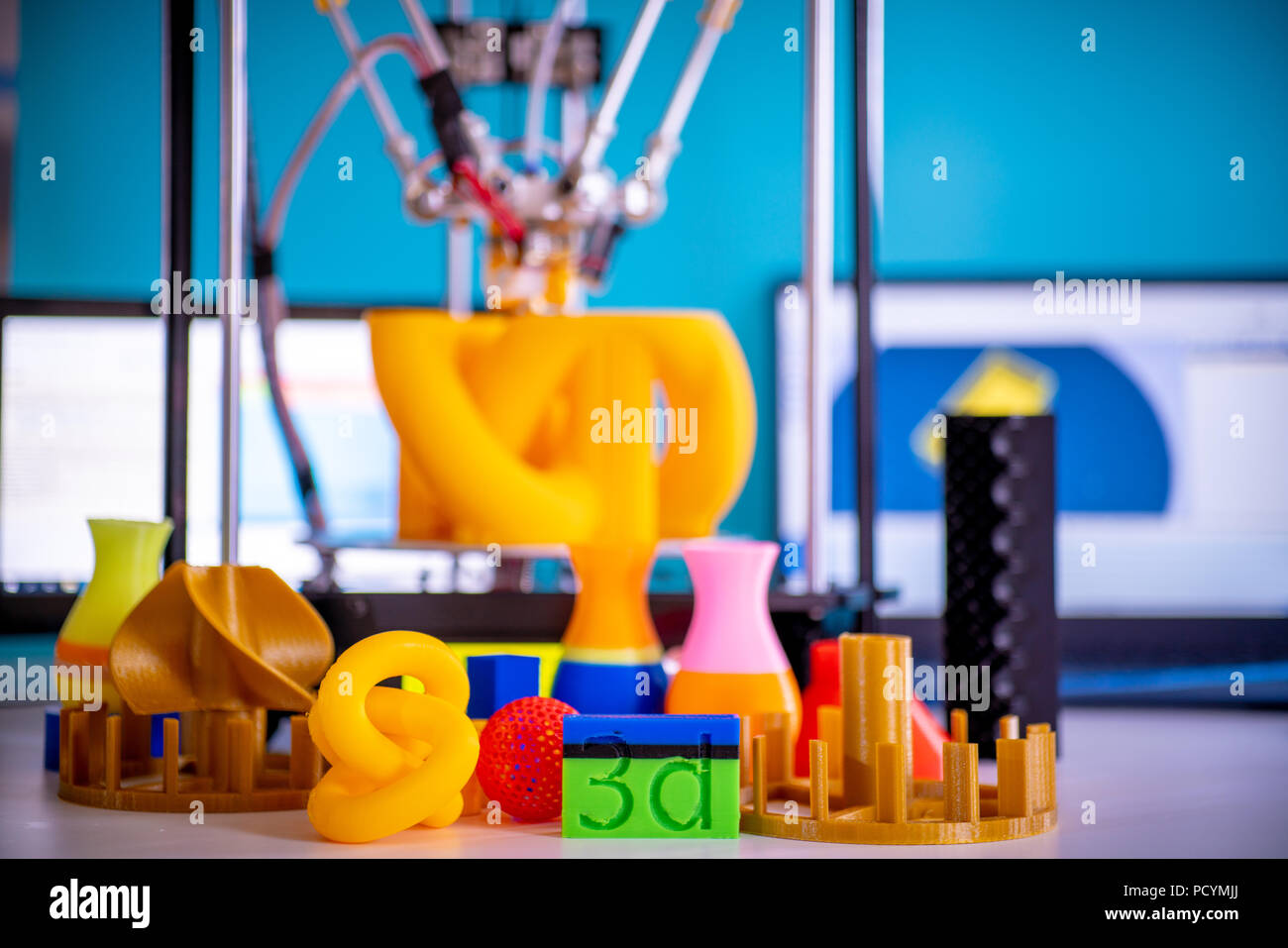 Print orange parts on a 3D printer in printing process Stock Photo - Alamy