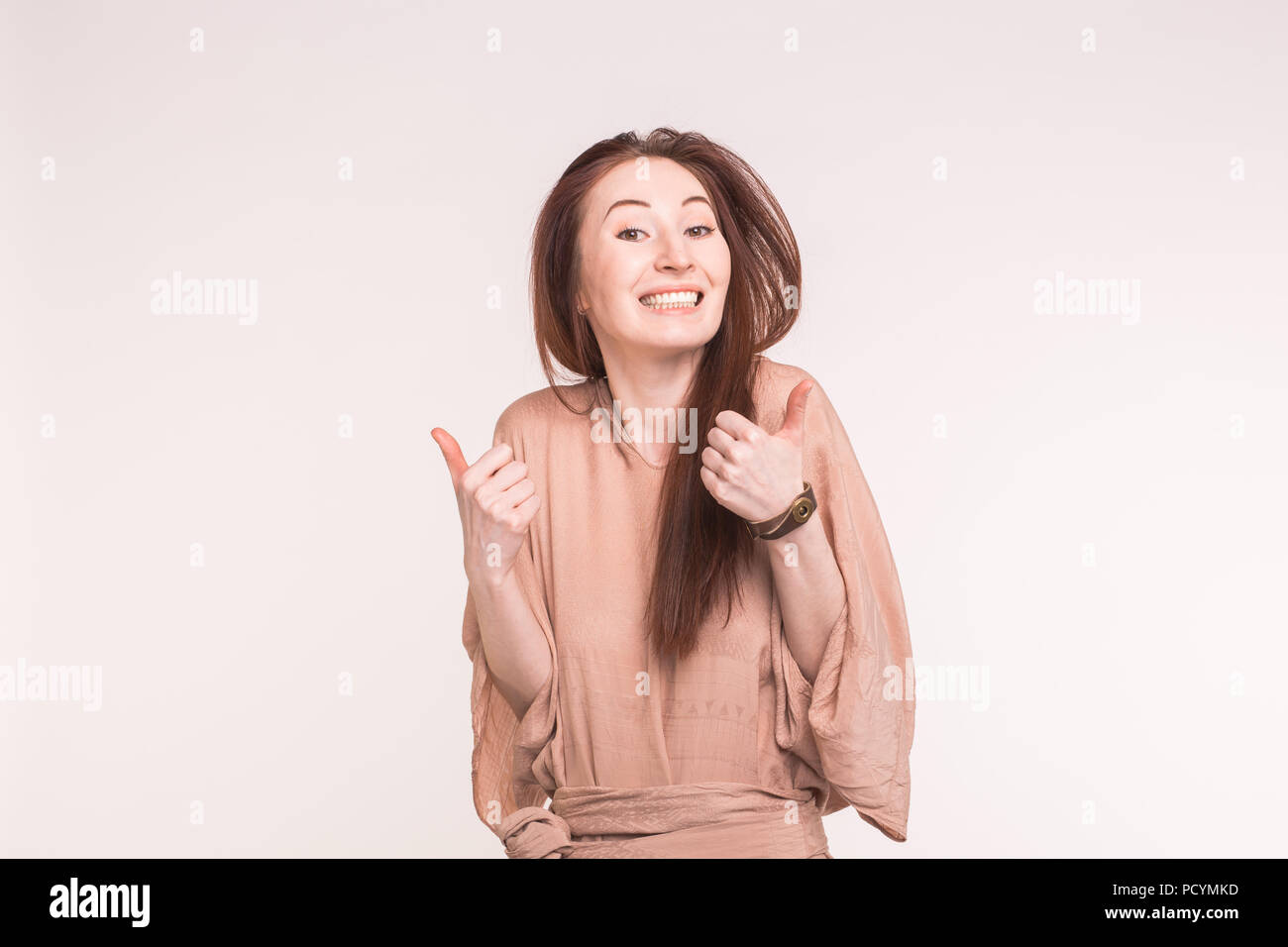 Fashion, style and gesture concept - happy smiling young woman over ...