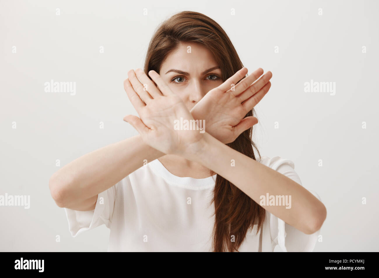 Angry young woman raising hand hi-res stock photography and images - Alamy