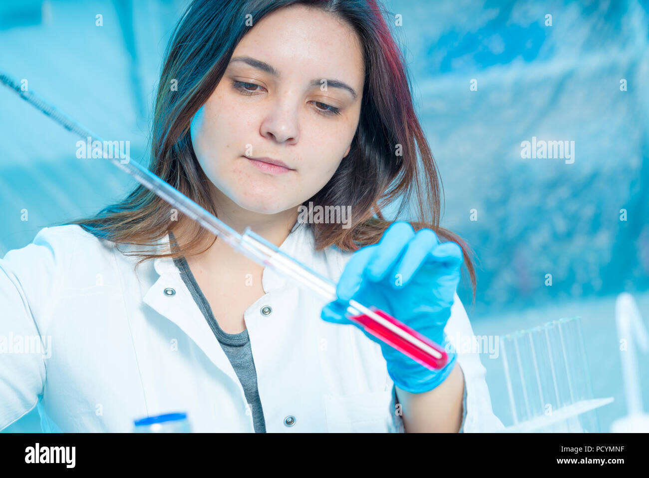 Scientists mixing chemicals. Chemical experiment Stock Photo - Alamy