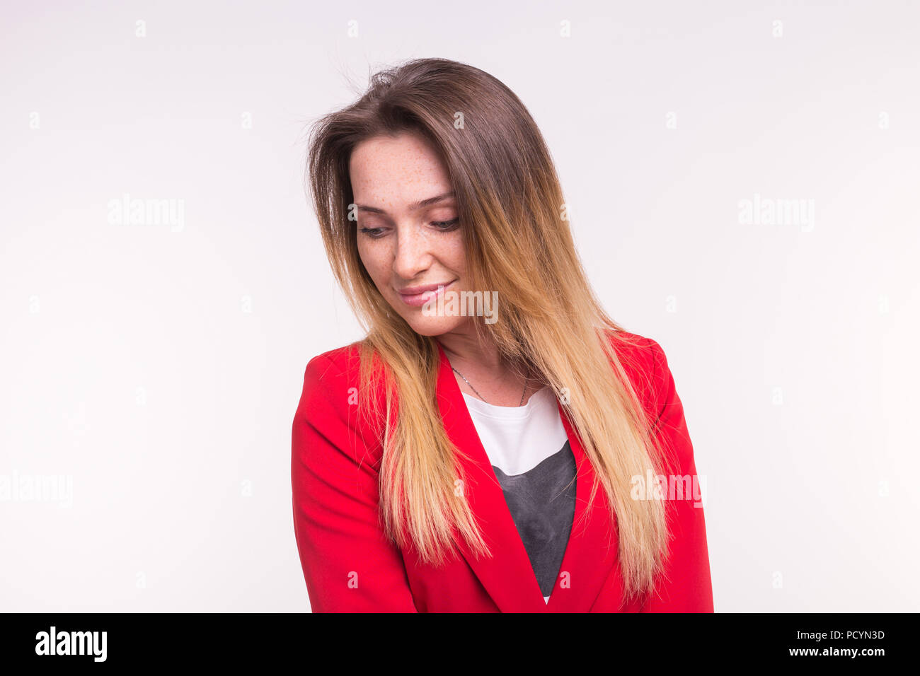 Portrait of embarrassed freckled beautiful woman wearing red suit Stock ...