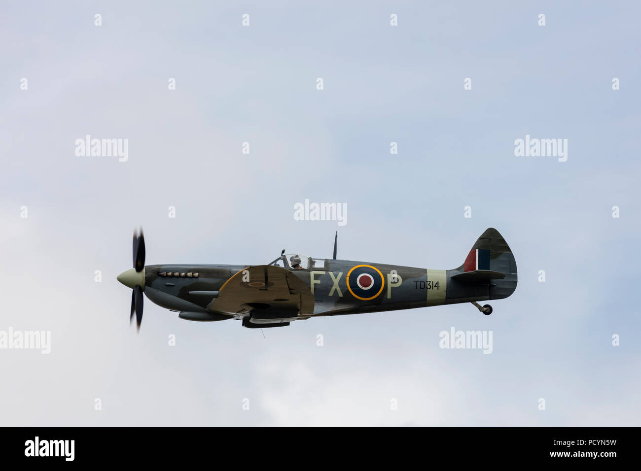 Side view of a historic RAF Spitfire aeroplane in flight Stock Photo ...