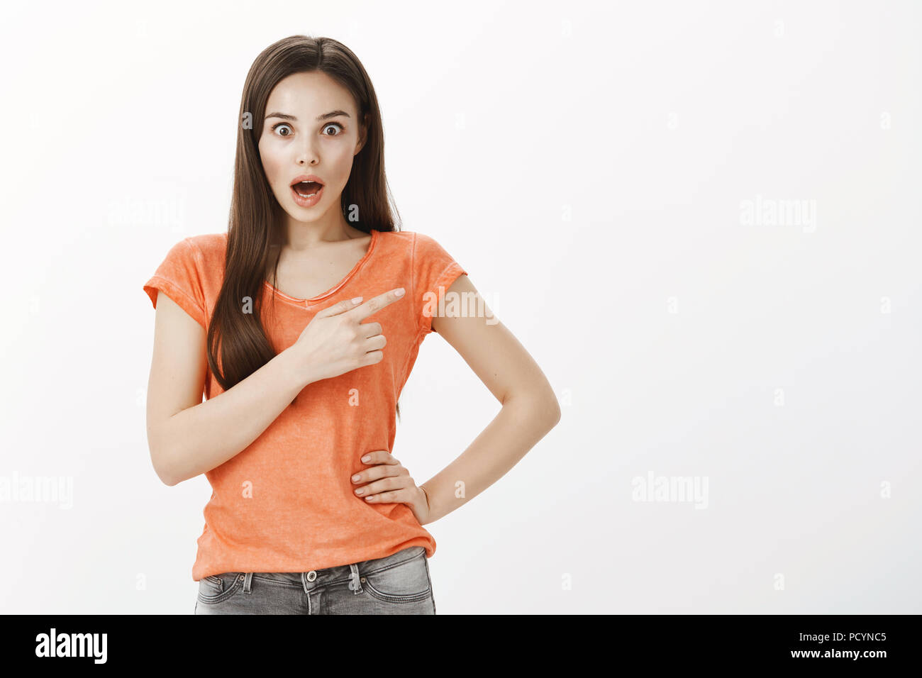 Did you heard what she said. Studio shot of amazed and stunned ...