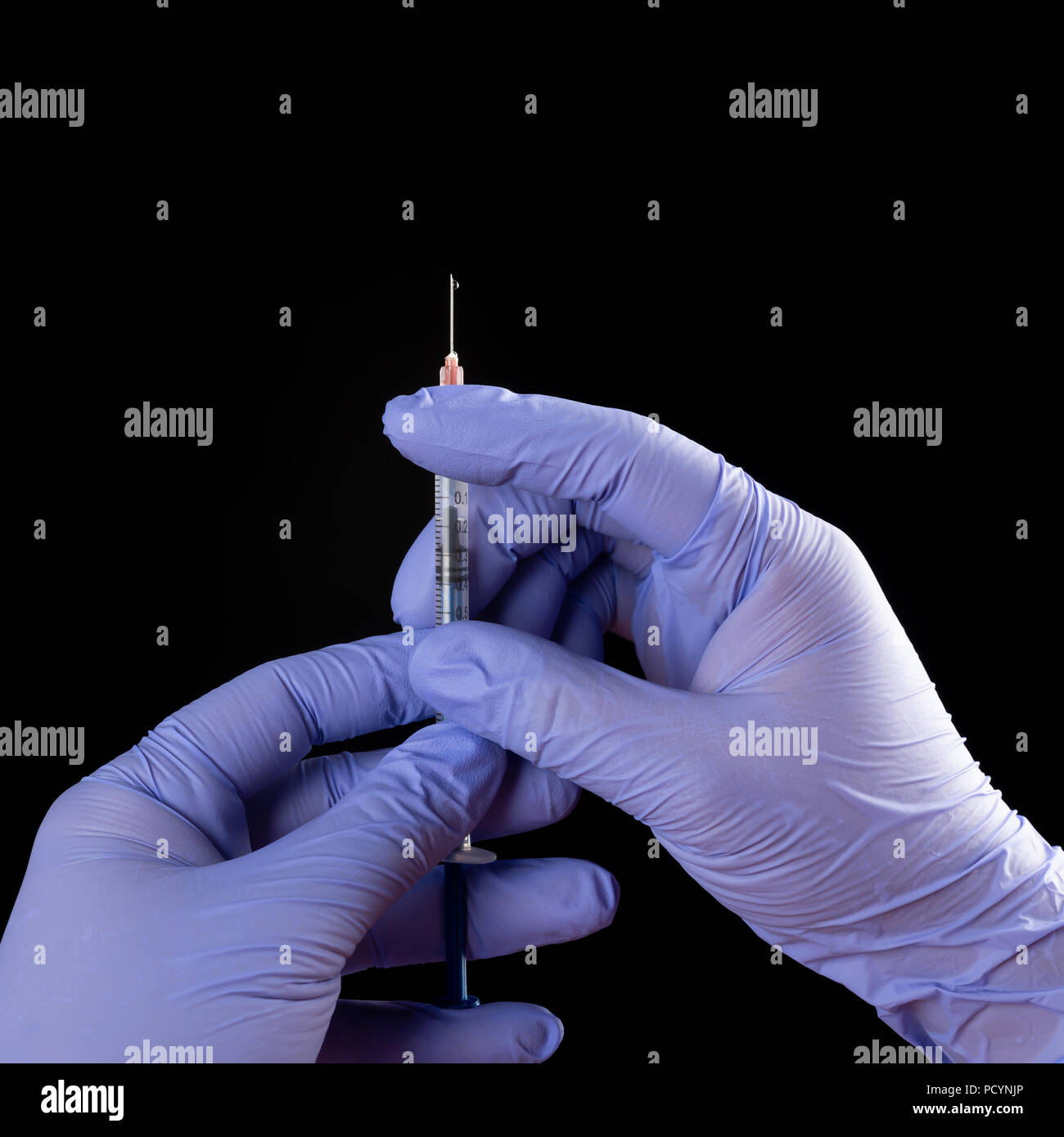 hands holding syringe medical injection on black background Stock Photo ...