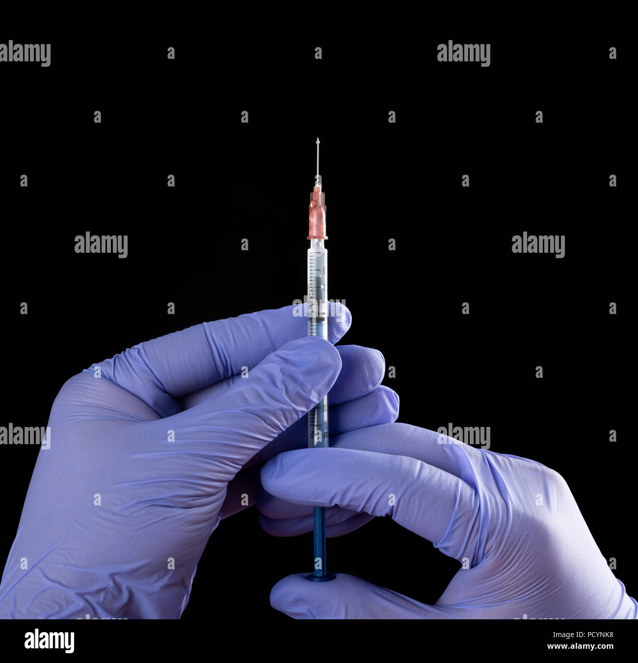 hands holding syringe medical injection on black background Stock Photo ...