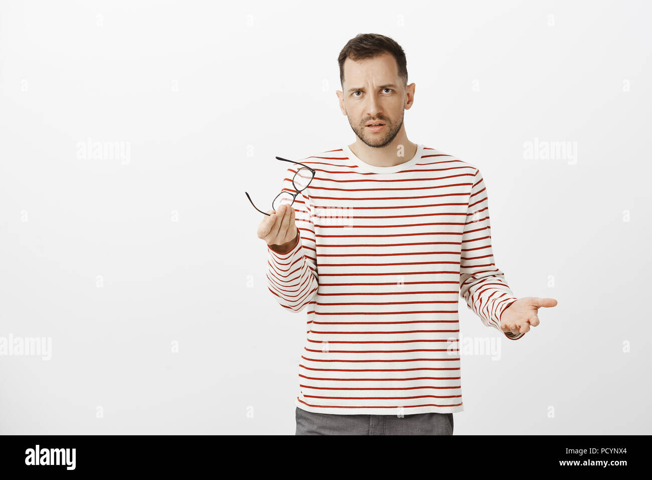 What is your point. Portrait of intense serious handsome guy, taking ...