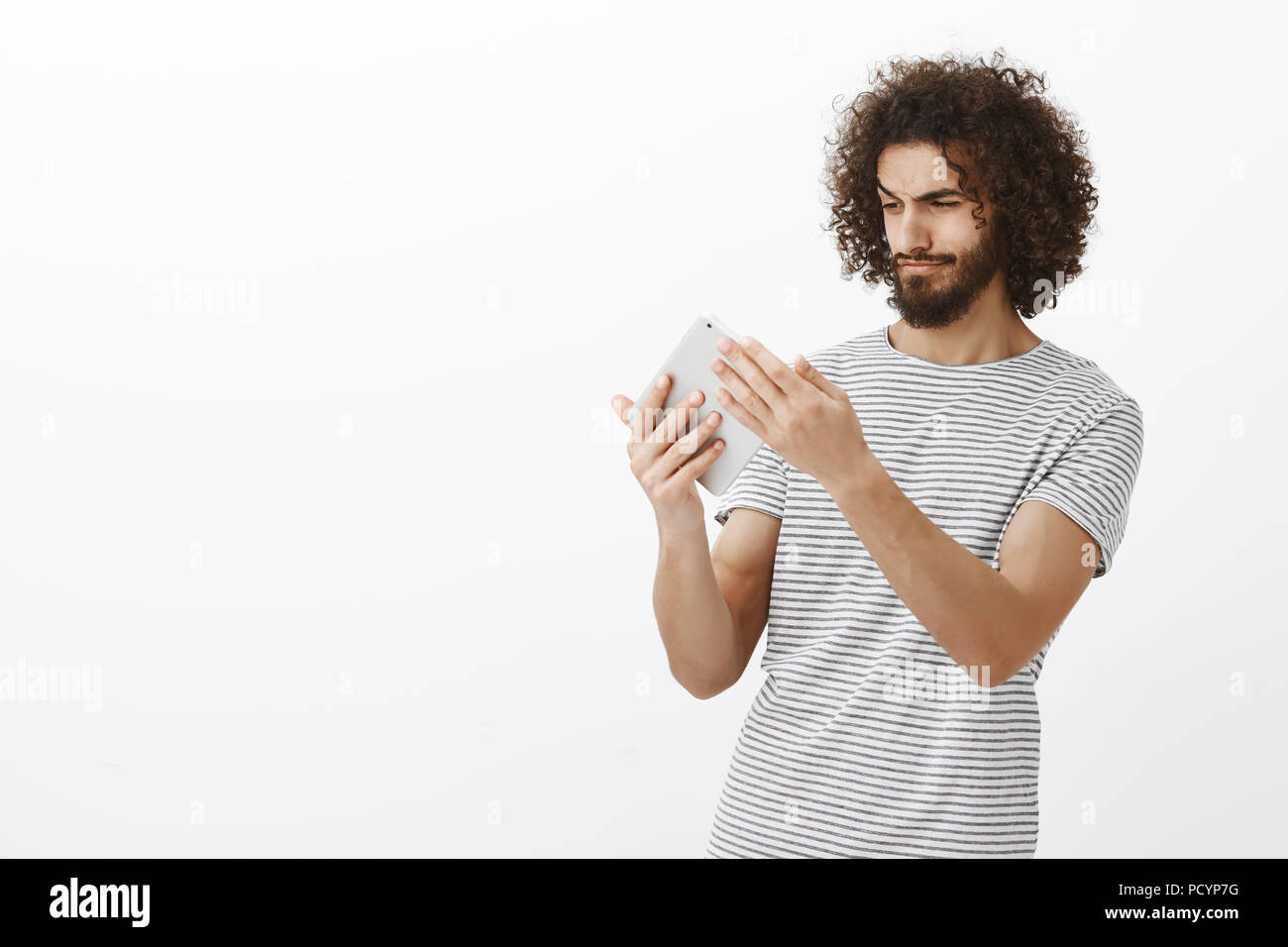 Portrait of creative hispanic male designer with stylish haircut and ...