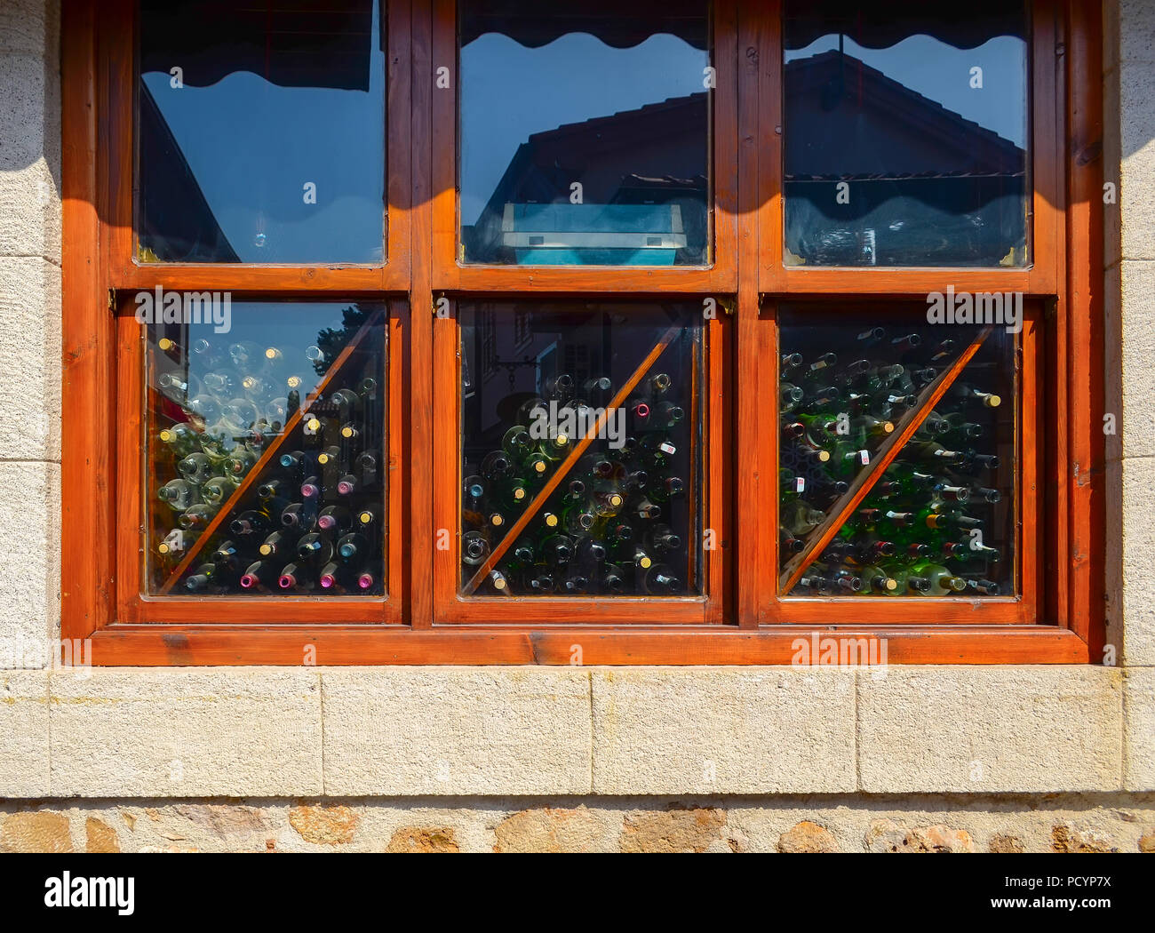 Window of a warehouse of empty wine glass bottles Stock Photo - Alamy