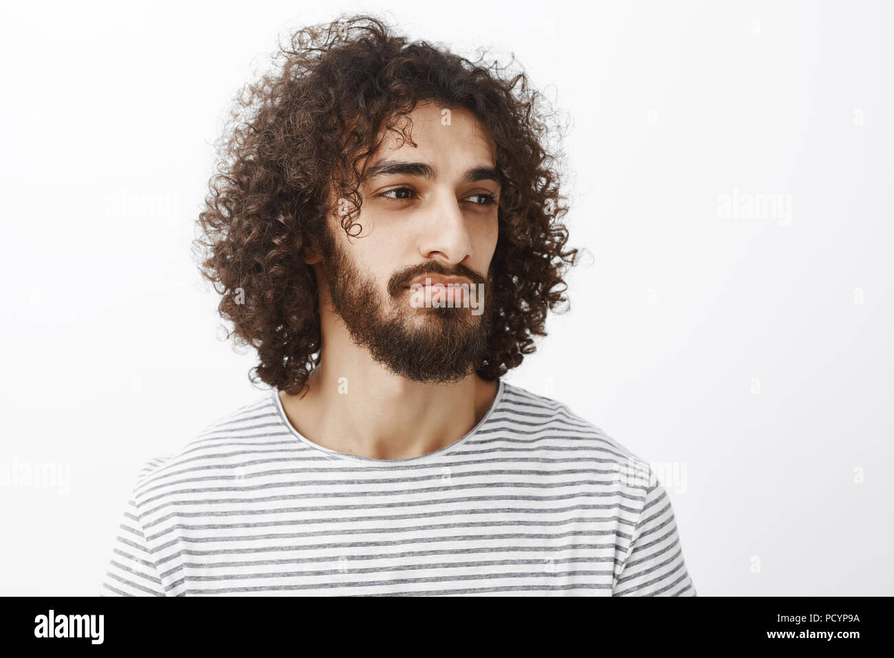 Portrait Of Smart Deamy Attractive Bearded Man With Curly Hair Looking