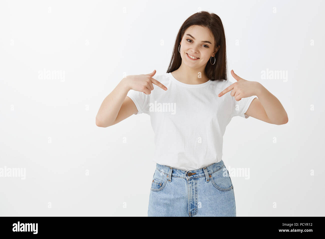 Look at me. Horizontal shot of charming confident and relaxed woman in ...