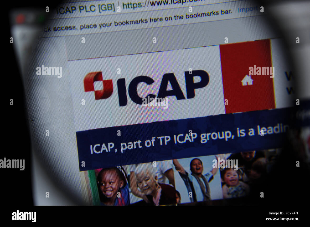The ICAP website seen through a magnifying glass Stock Photo - Alamy