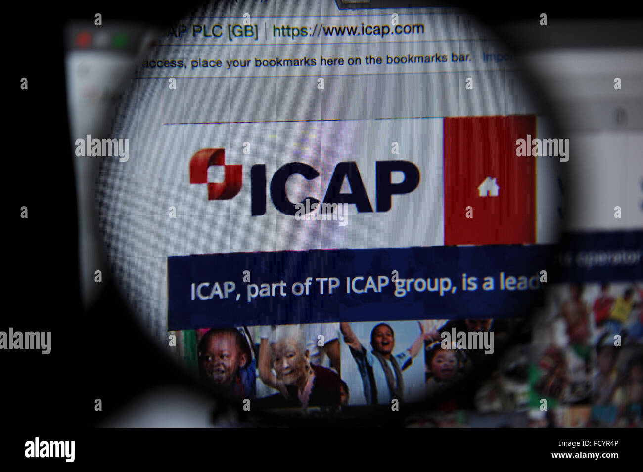 The ICAP website seen through a magnifying glass Stock Photo - Alamy
