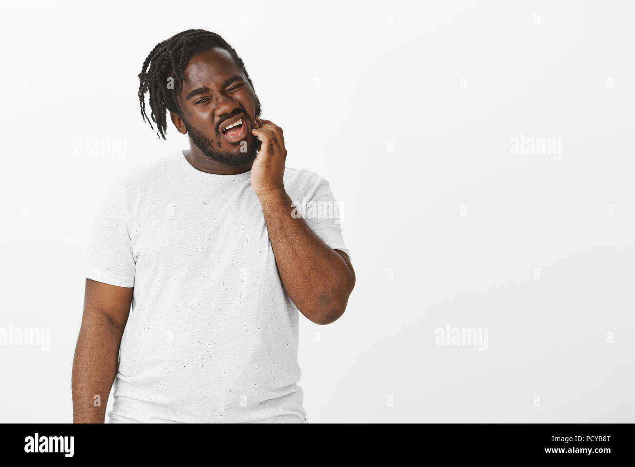 Boyfriend unsure how to refuse offer. Portrait of doubtful attractive ...