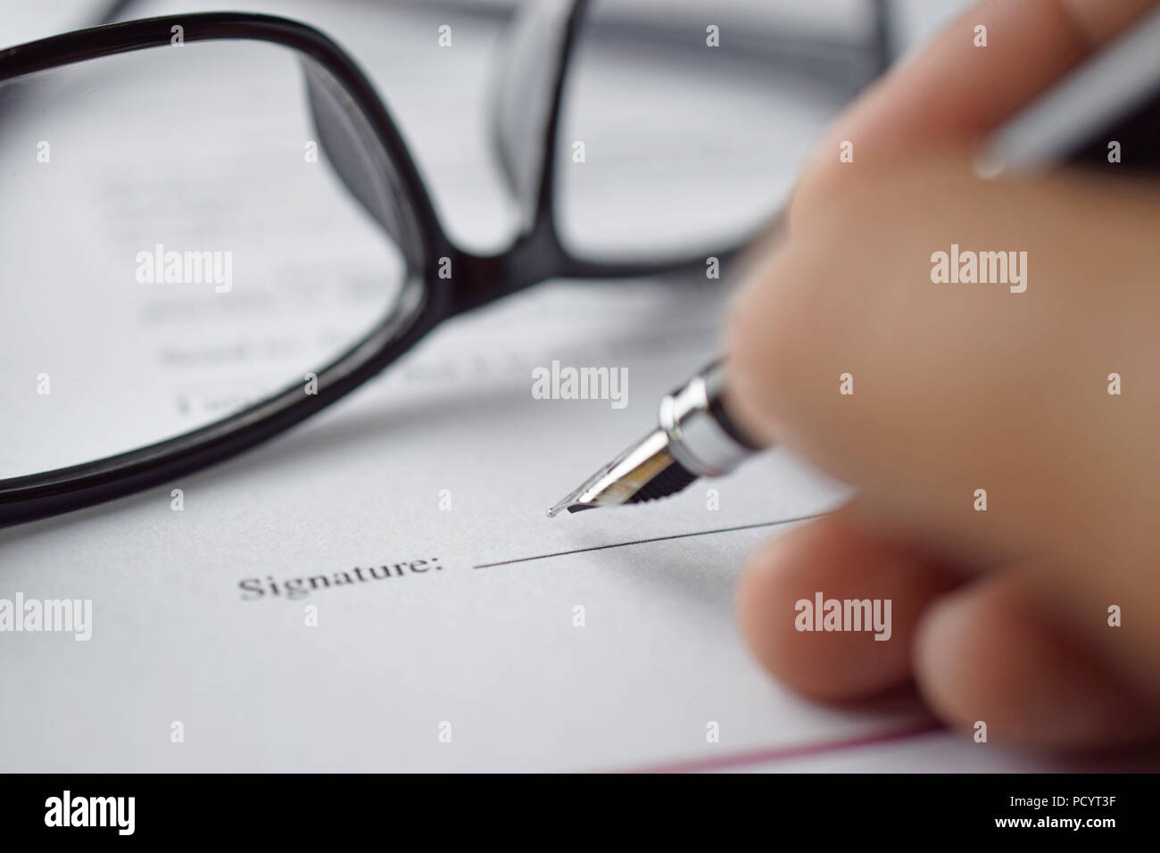 Signing a form, closeup Stock Photo - Alamy
