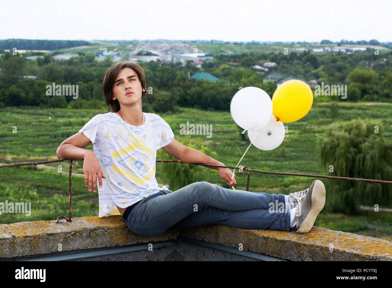 Man flying helium balloons hi-res stock photography and images - Alamy
