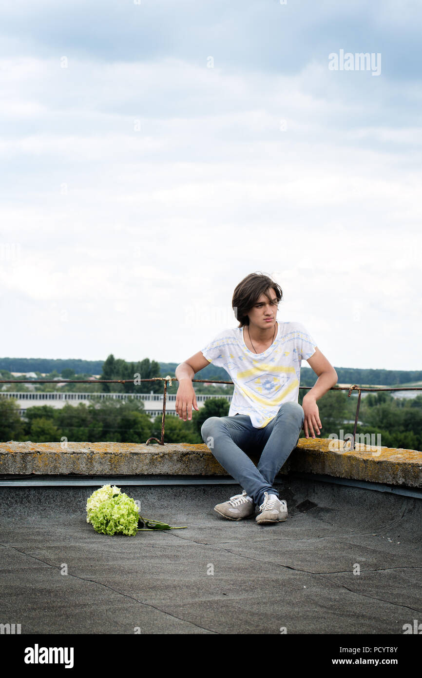 sad guy with flowers Stock Photo - Alamy