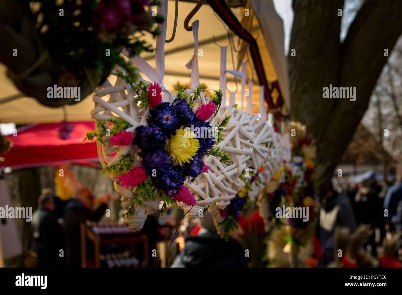 Colorful fair decorations. Handicraft toys made of straw and vines ...