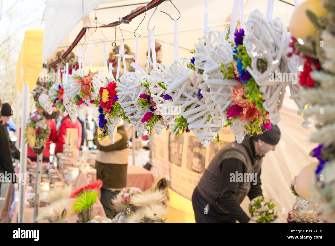 Colorful fair decorations. Handicraft toys made of straw and vines ...