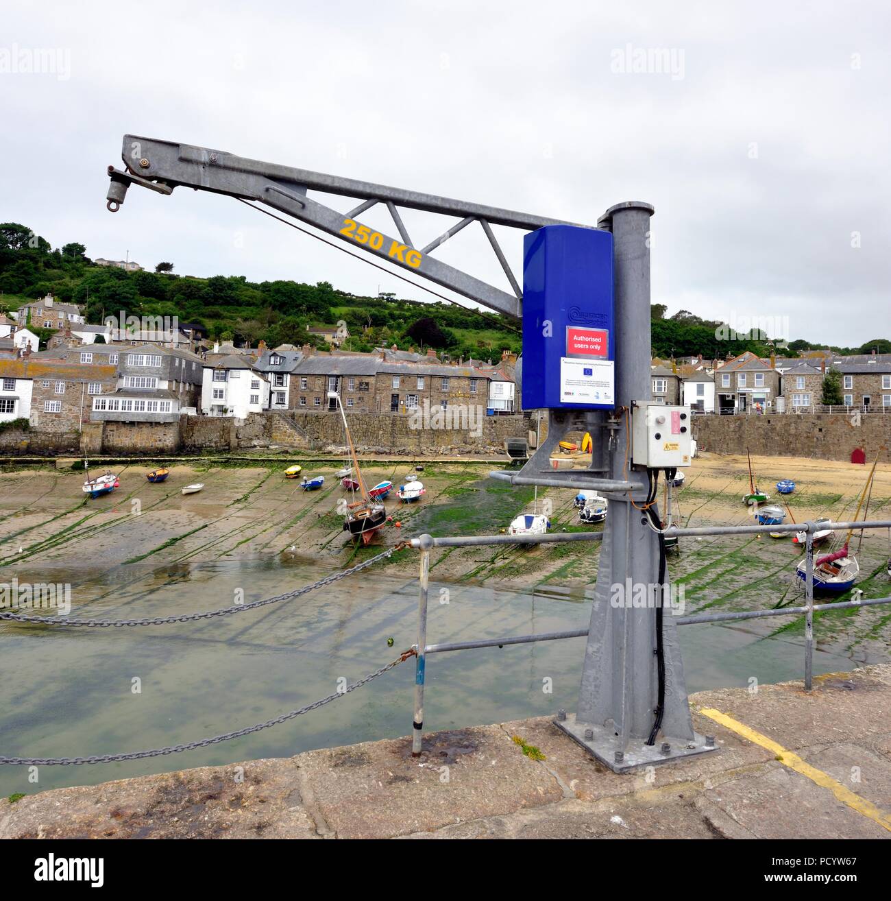 Unloading winch and davit,Mousehole Harbour,Cornwall,England,UK Stock ...