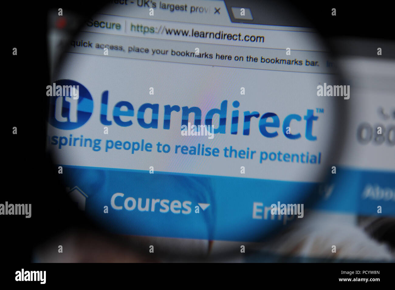 The Learndirect website seen through a magnifying glass Stock Photo - Alamy
