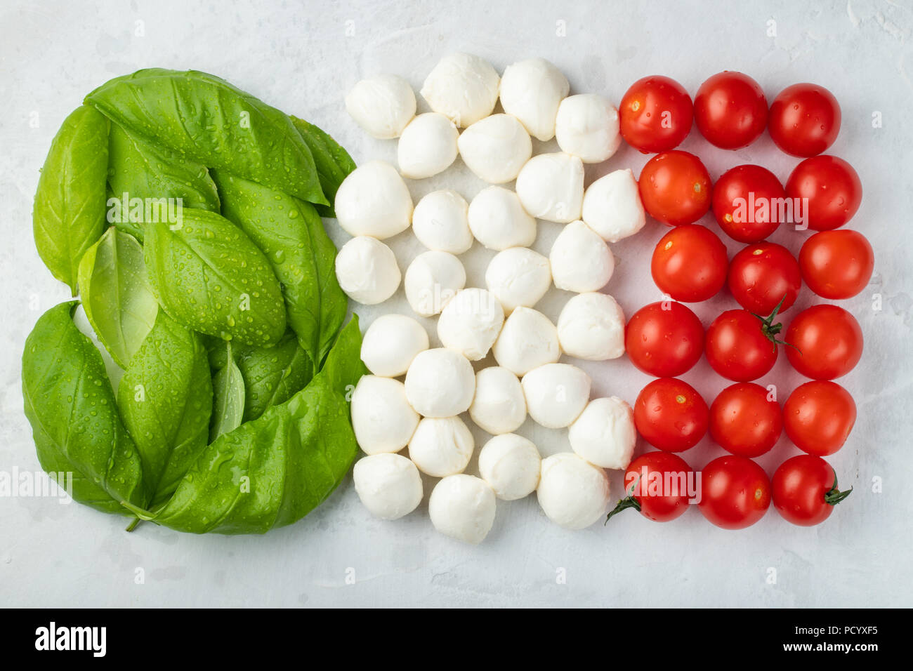 Italian flag made with Tomato Mozzarella and Basil. The concept of ...