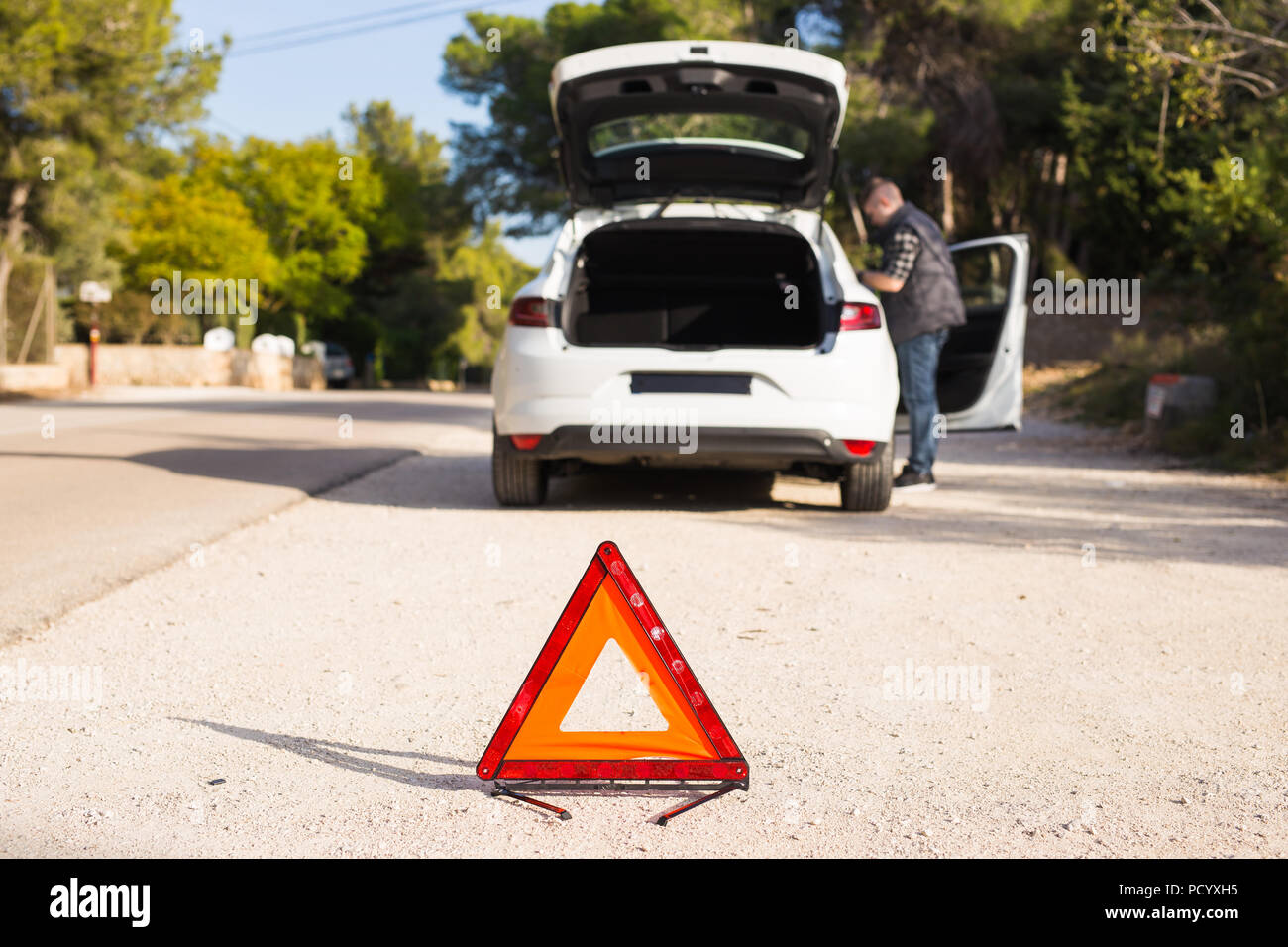 Trouble with the car on the road must put an emergency sign Stock Photo ...