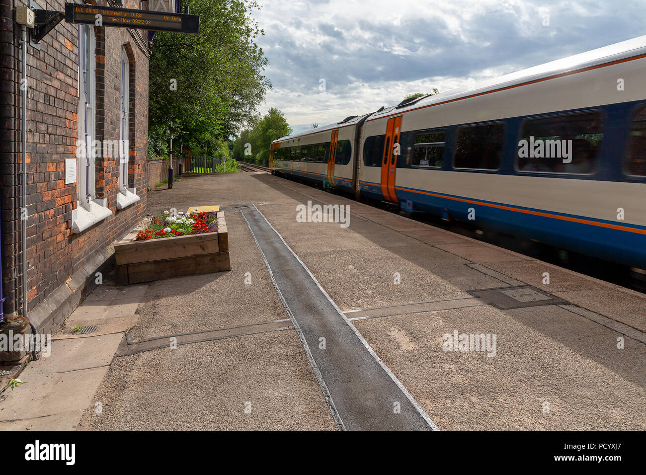 Looking along the platform as a train speeds past at the Historic ...