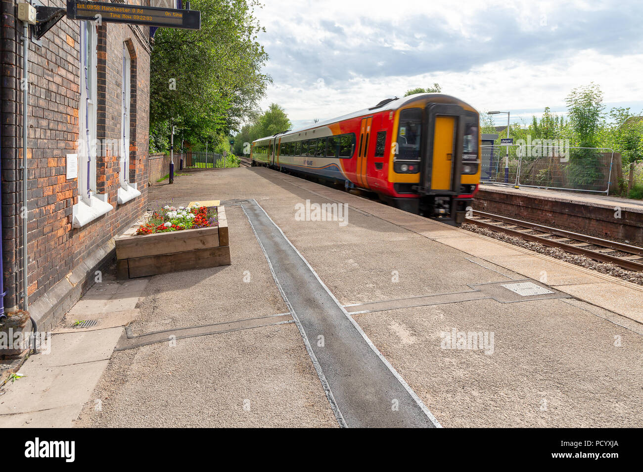 Looking along the platform as a train speeds past at the Historic ...