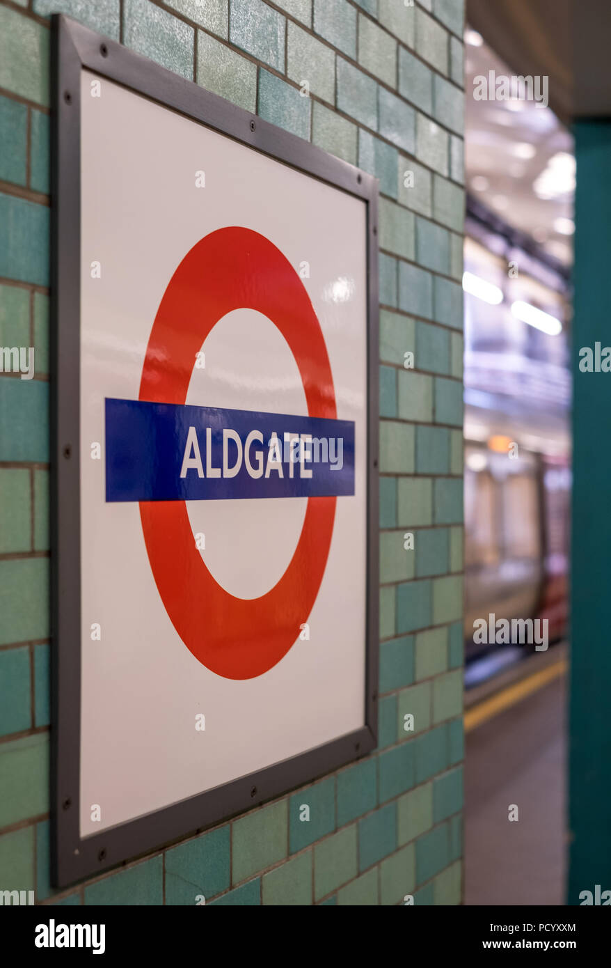 Platform at Aldgate Underground Station, London showing station name in ...