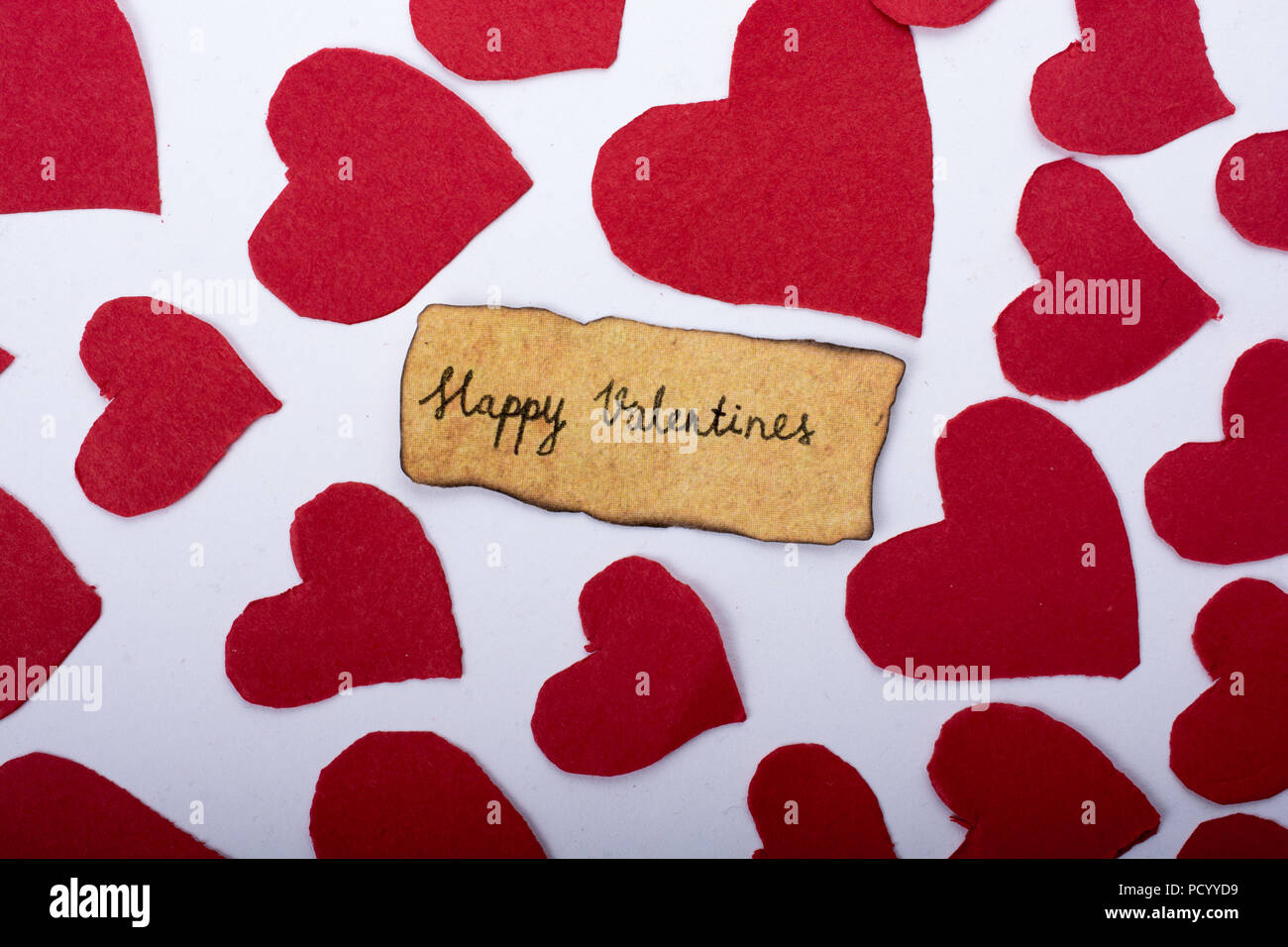 Valentine's day wording on torn paper as Love concept Stock Photo - Alamy