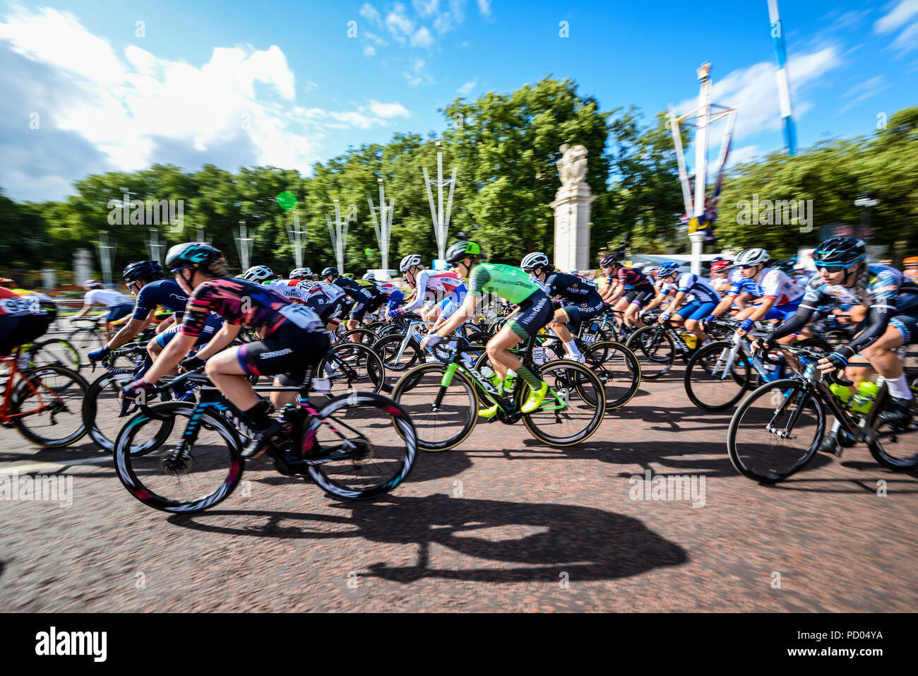 Female cyclists peloton racing along The Mall in London, UK, during the ...