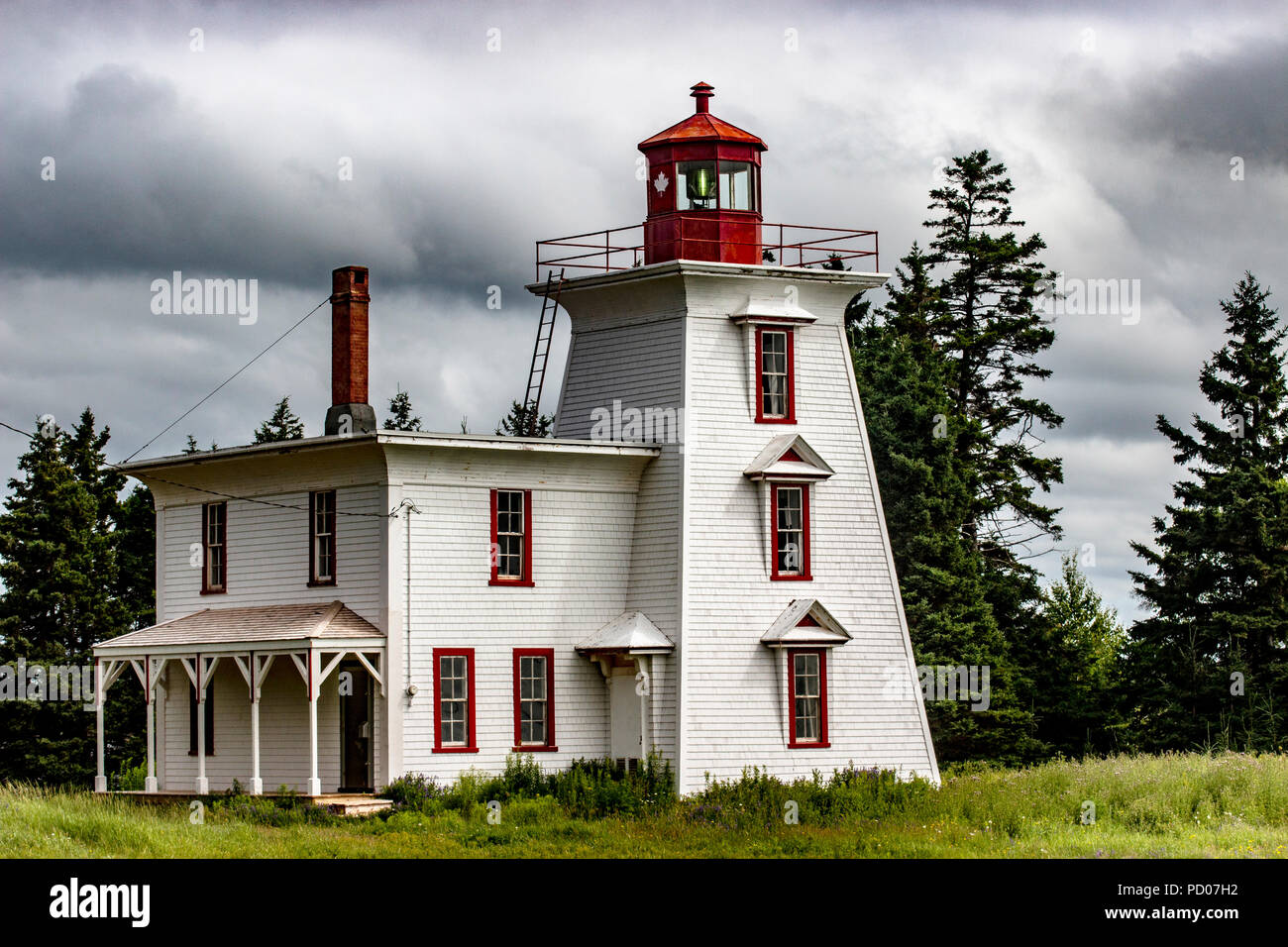 White framed, red trimmed square tapered Blockhouse Point Lighthouse ...