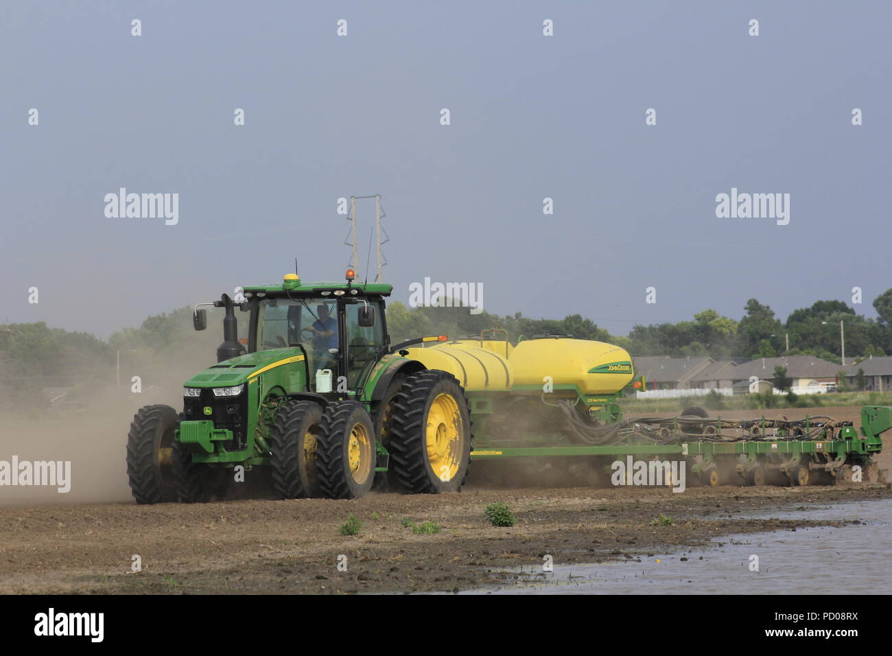 Planting the field with a John Deere Tractor Stock Photo - Alamy